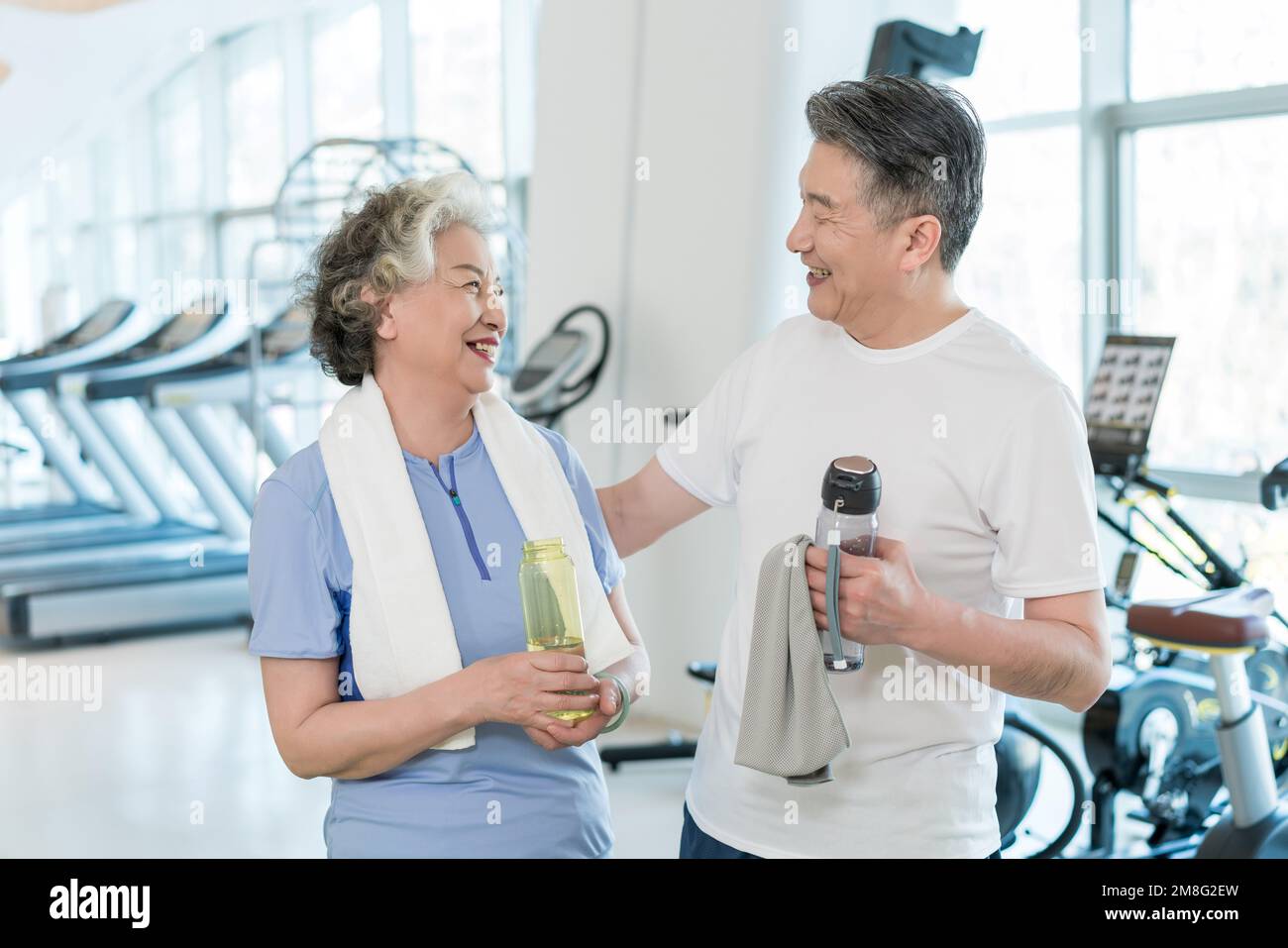 Elderly couple in the gym for a workout Stock Photo - Alamy