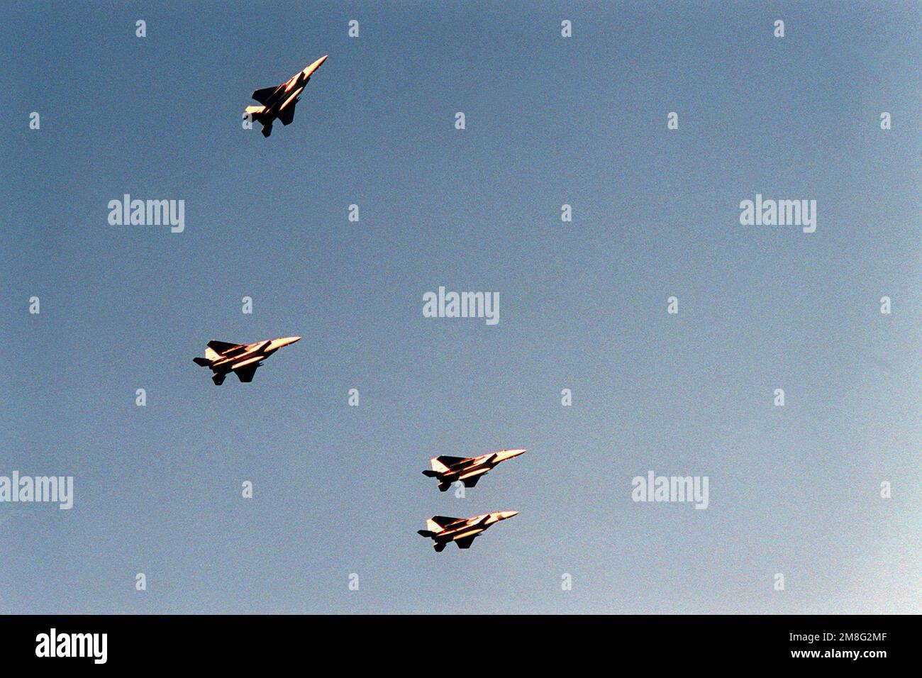 F-15 Eagle aircraft of the Hawaiian Air National Guard fly over the USS ...