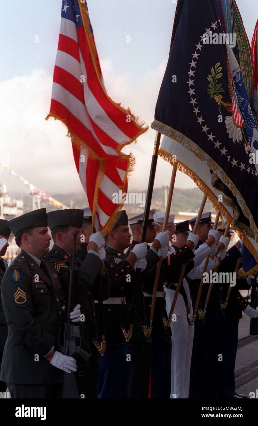 A joint service color guard presents the colors during an observance ...