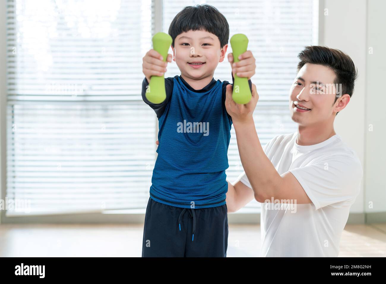 Father and son in the gym Stock Photo - Alamy