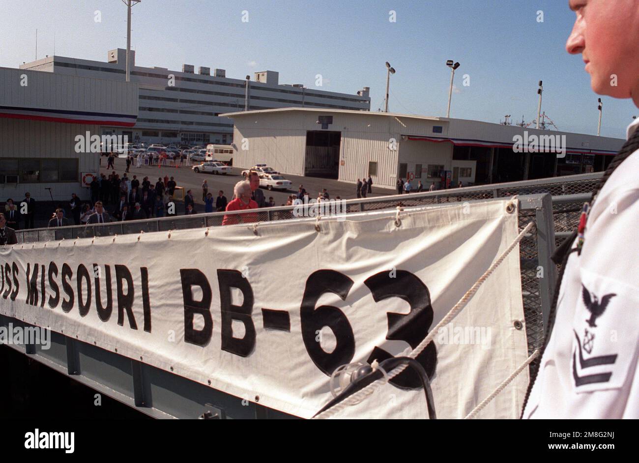 President George Bush and Mrs. Bush walk up the gangplank of the ...