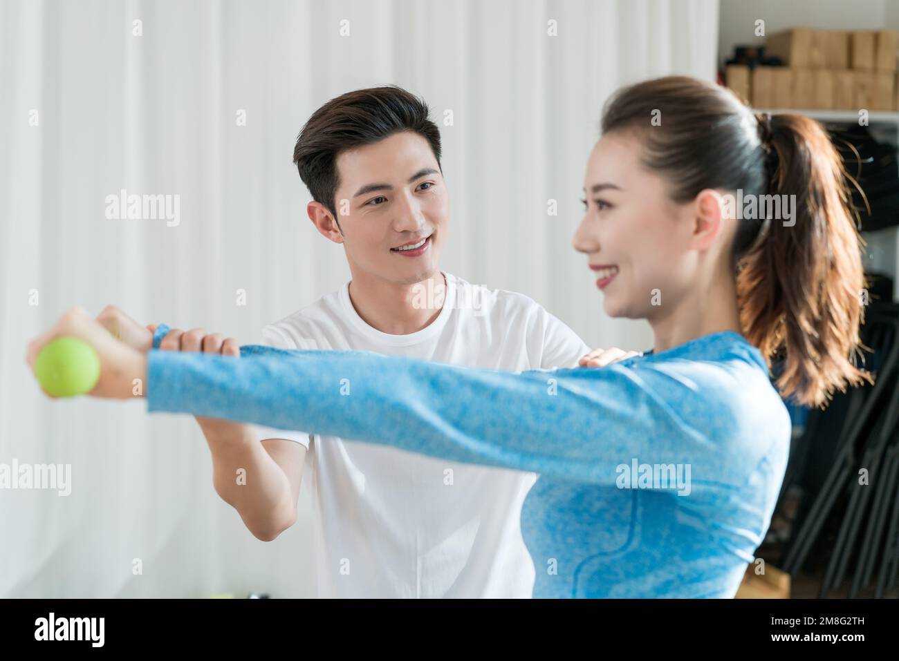 A young woman in private teaching under the guidance of fitness Stock ...