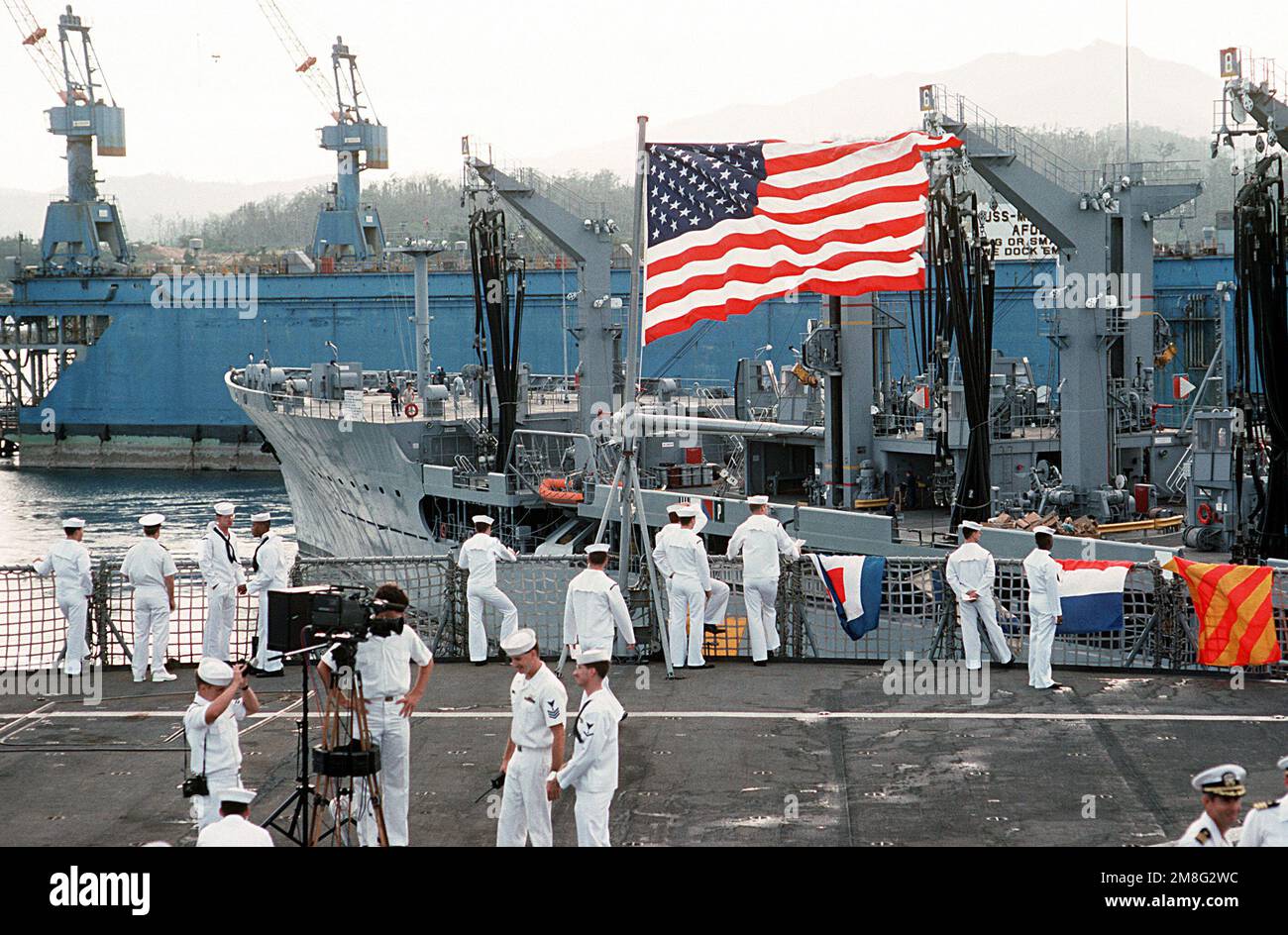 Crew members aboard the amphibious command ship USS BLUE RIDGE (LCC-19 ...