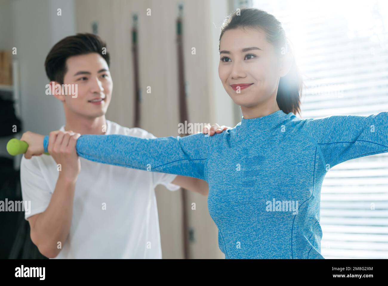 A young woman in private teaching under the guidance of fitness Stock ...