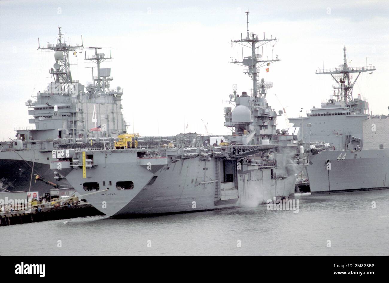 The amphibious assault ships USS NASSAU (LHA-4), left, and USS IWO JIMA ...