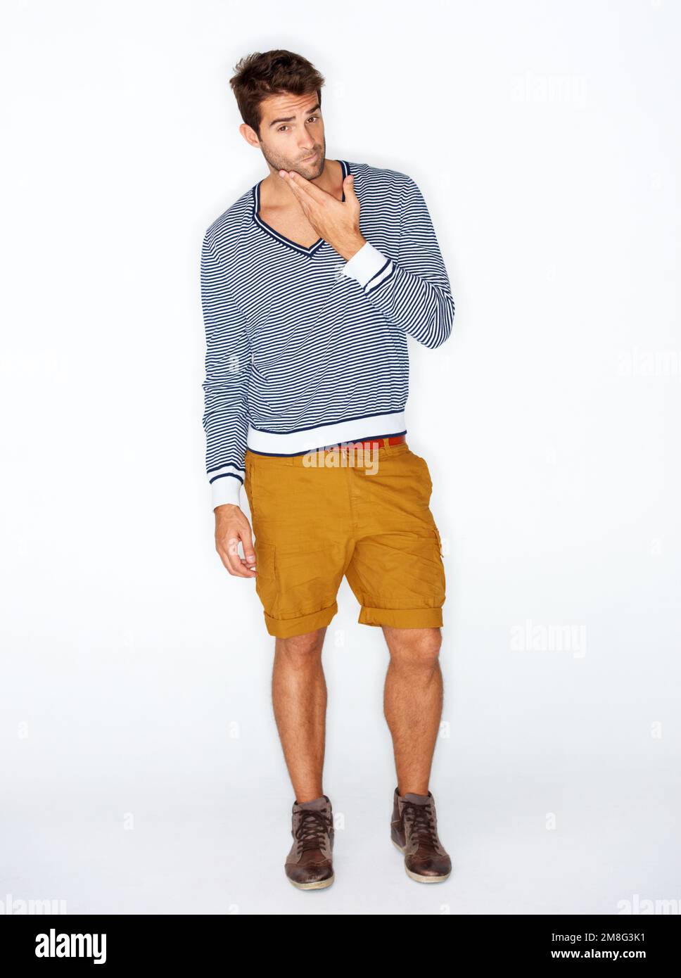 Feeling a bit sheepish...Stylish young guy against a white background ...