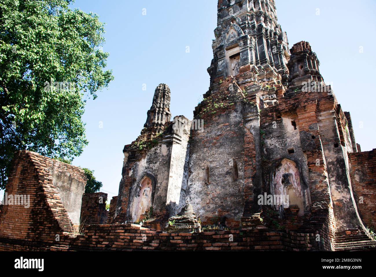 Ancient antique broken buddha statue and ruin damage old chedi stupa ...