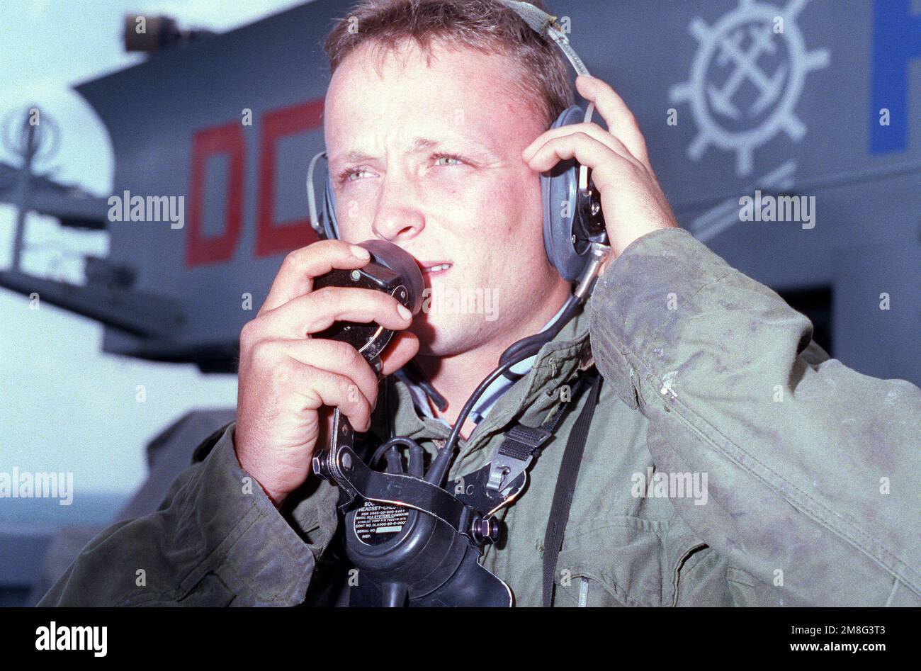 Boatswain's Mate SEAMAN Eric Daniel communicates using sound-powered ...