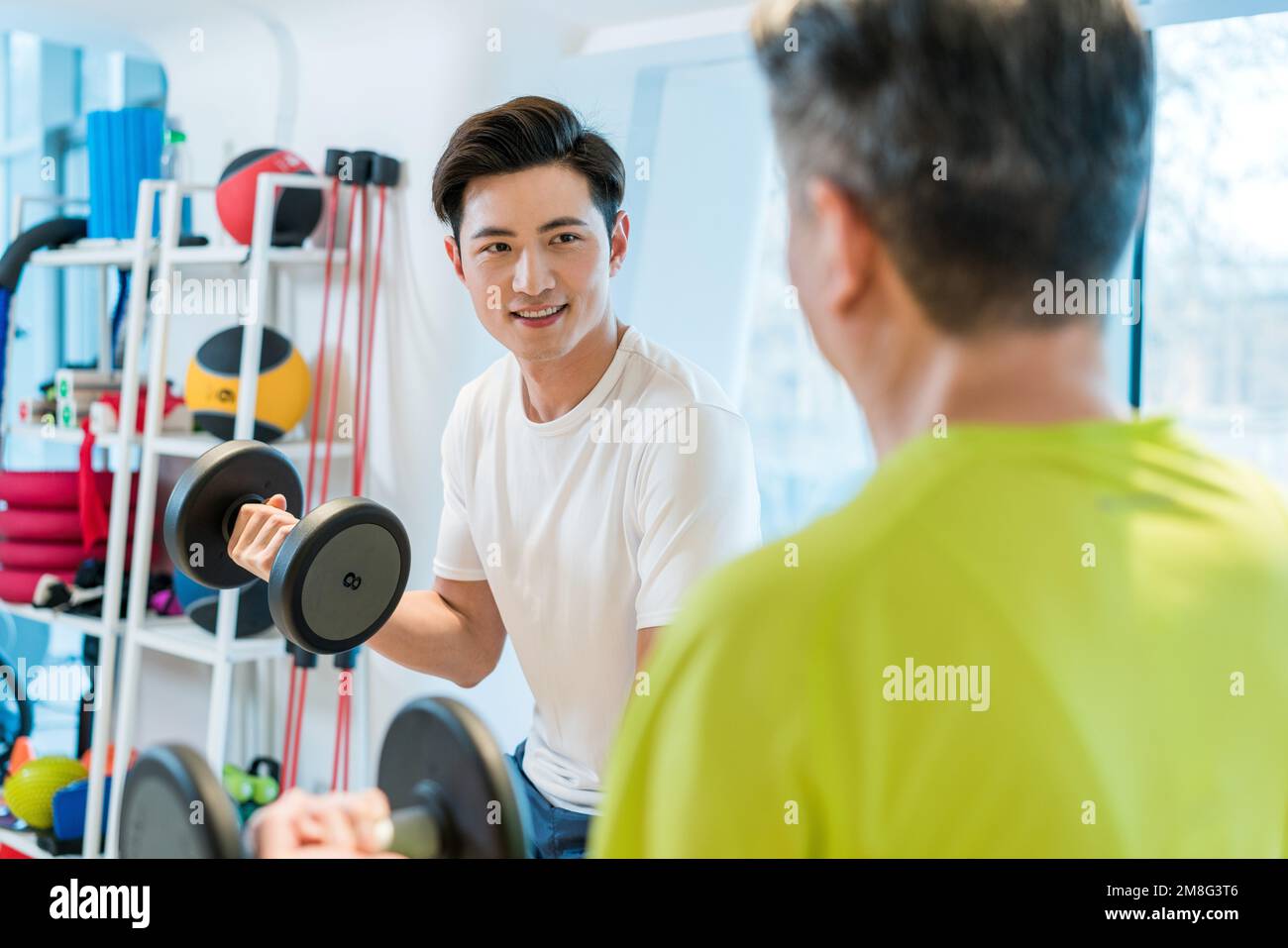Father and son in the gym Stock Photo - Alamy