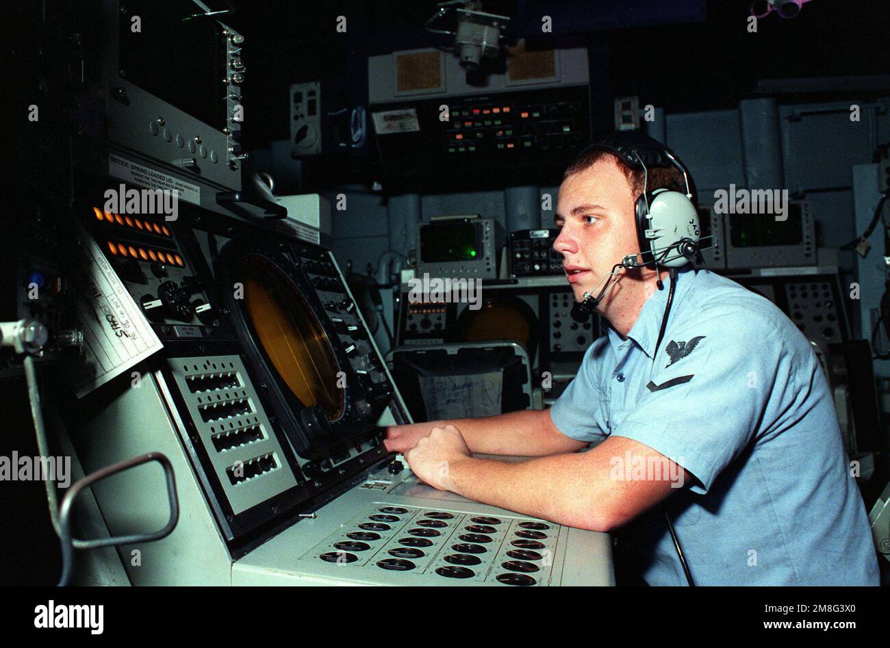 Operations SPECIALIST 3rd Class Mike Smotherman monitors a radar screen ...