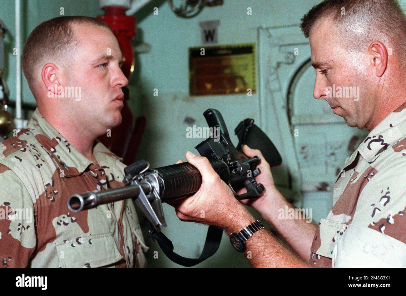 1SGT Kenneth Akins inspects CPL Lee Luca's M-16A2 rifle aboard the ...