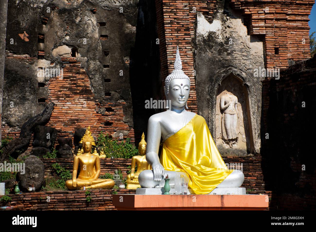 Ancient antique buddha statue and ruins old chedi stupa for thai people ...