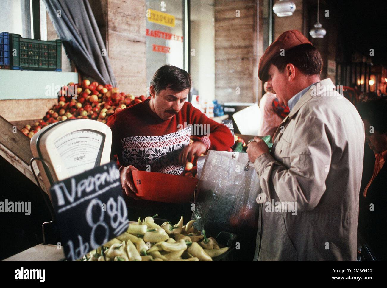 John Anderson selects produce at Budapest's central market. As husband ...