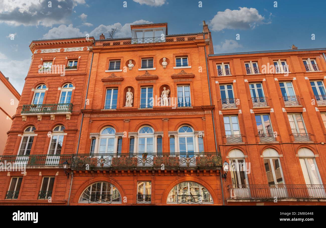 Facades of buildings in trinity square in Toulouse, Occitanie, France ...