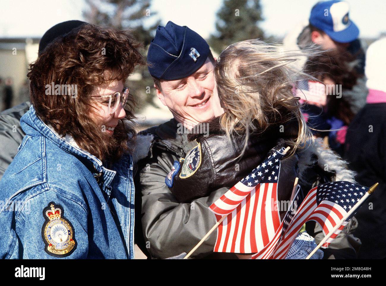 An Air Force family is reunited as a pilot returns home from serving in ...