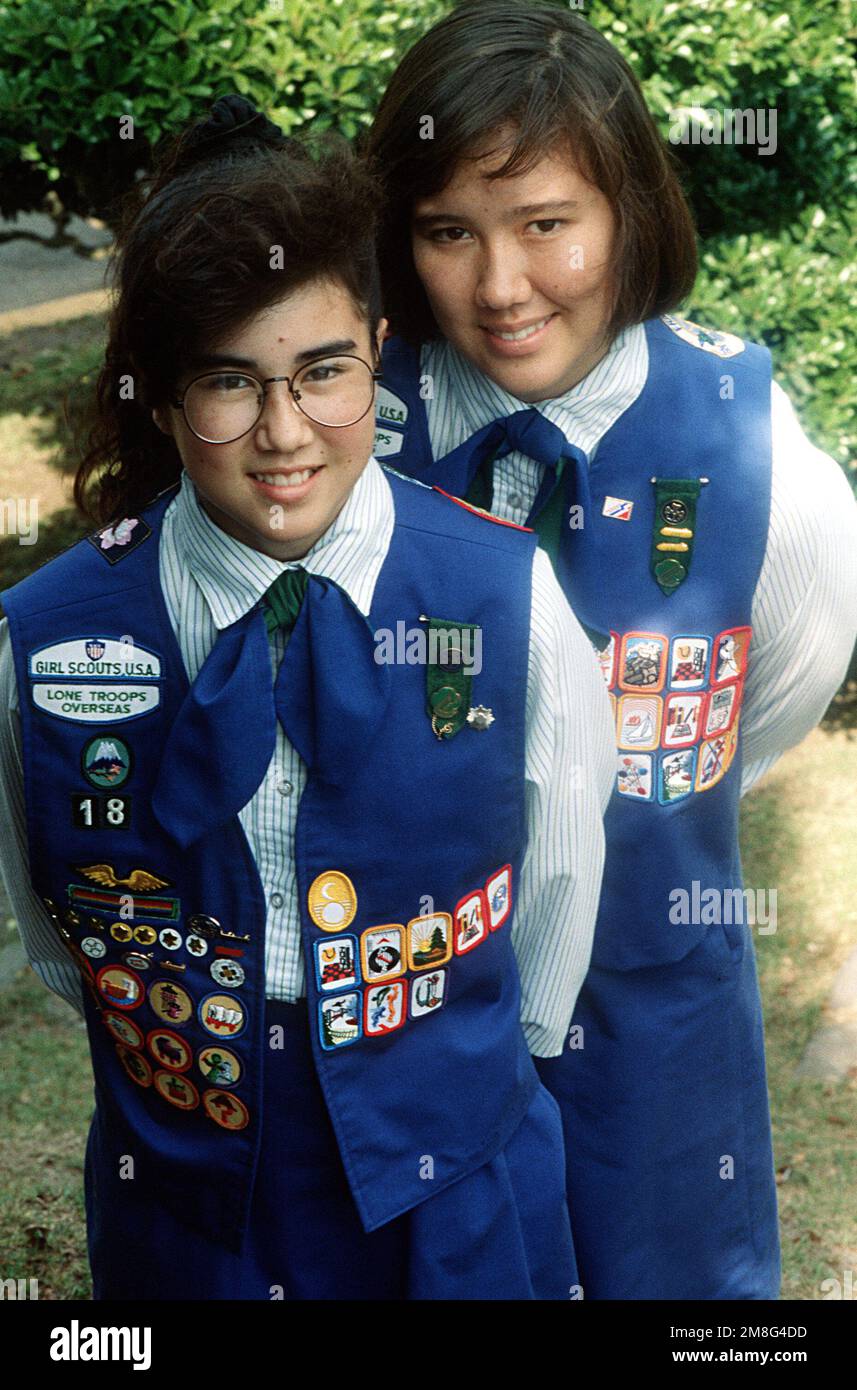 Alisha, left, and Jennifer Duncan proudly display their merit badges ...