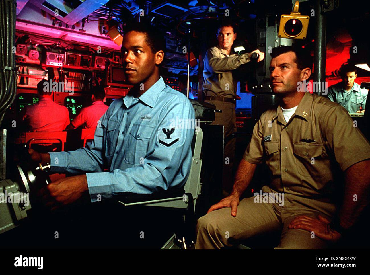 A 3rd class petty officer and a chief watch the readings at the diving ...