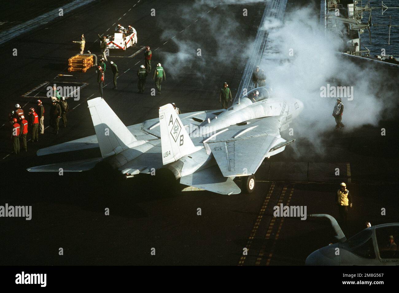 A Fighter Squadron 102 (VF-102) F-14A Tomcat aircraft is partially ...