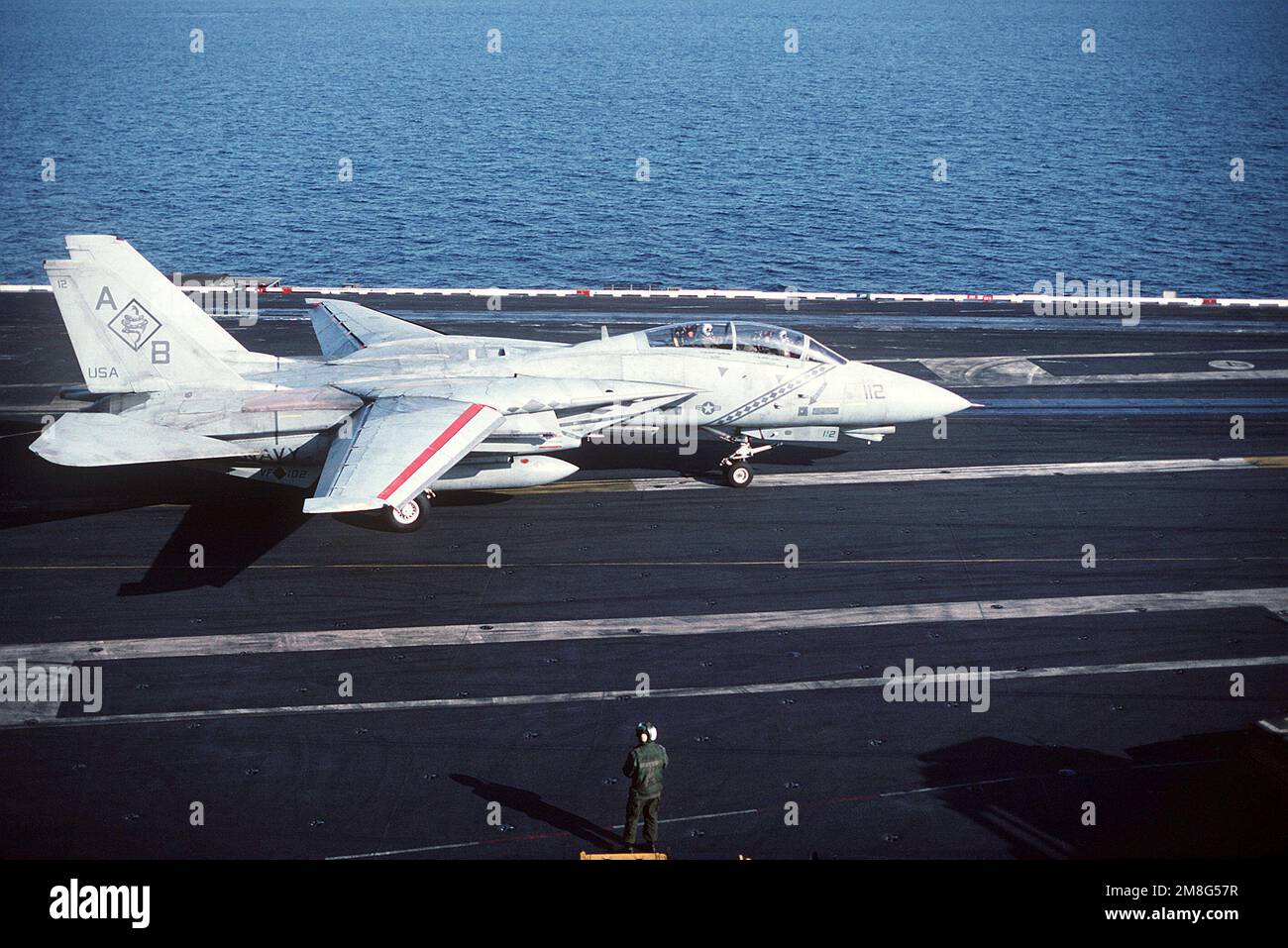 A Fighter Squadron 102 (VF-102) F-14A Tomcat aircraft is ready for launch from the flight deck ...
