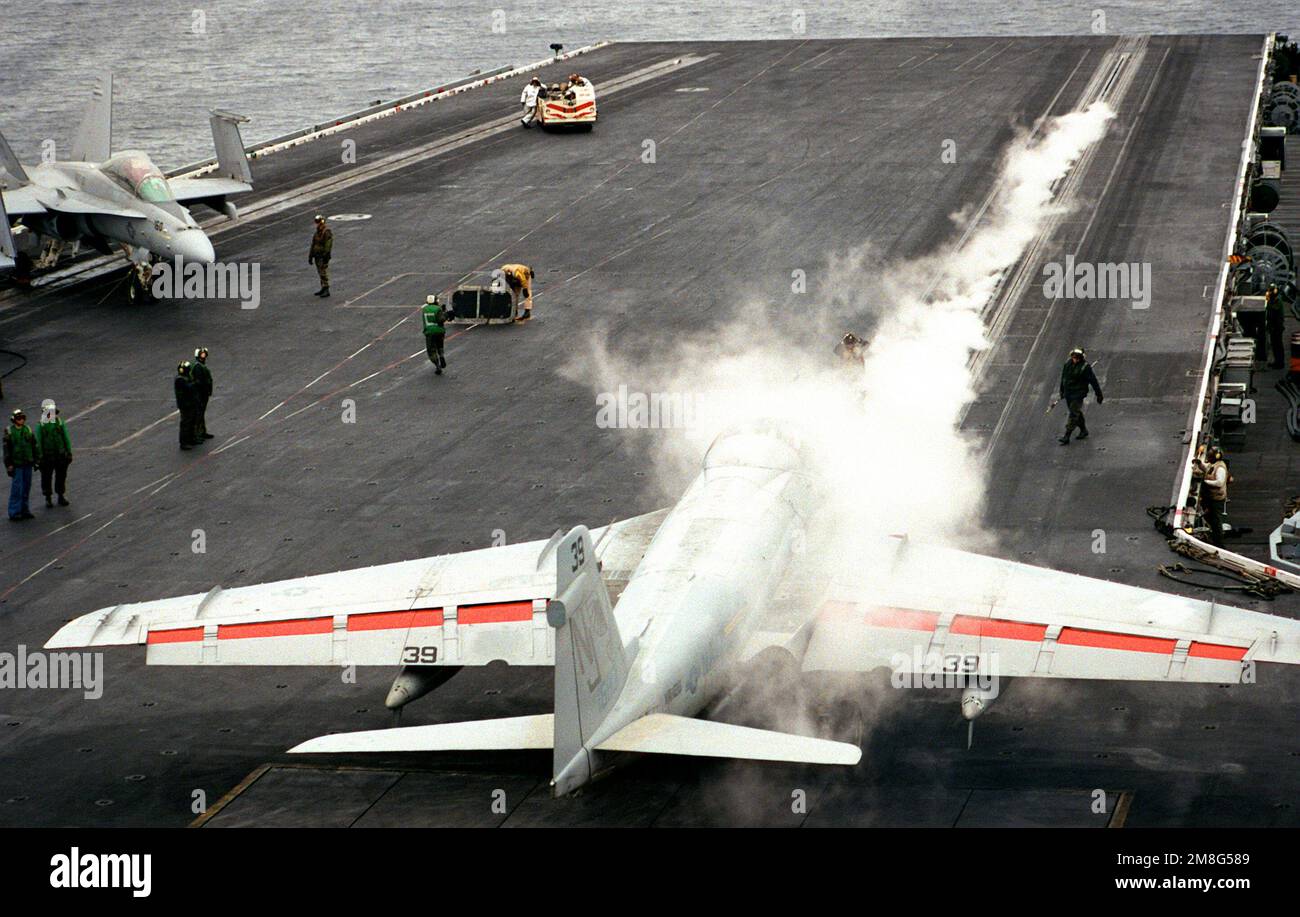 An Attack Squadron 128 (VA-128) A-6E Intruder aircraft is eveloped by ...