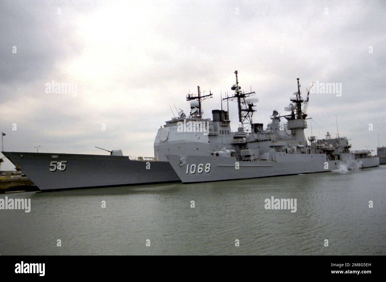 The guided missile cruiser USS LEYTE GULF (CG-55), left, and the ...
