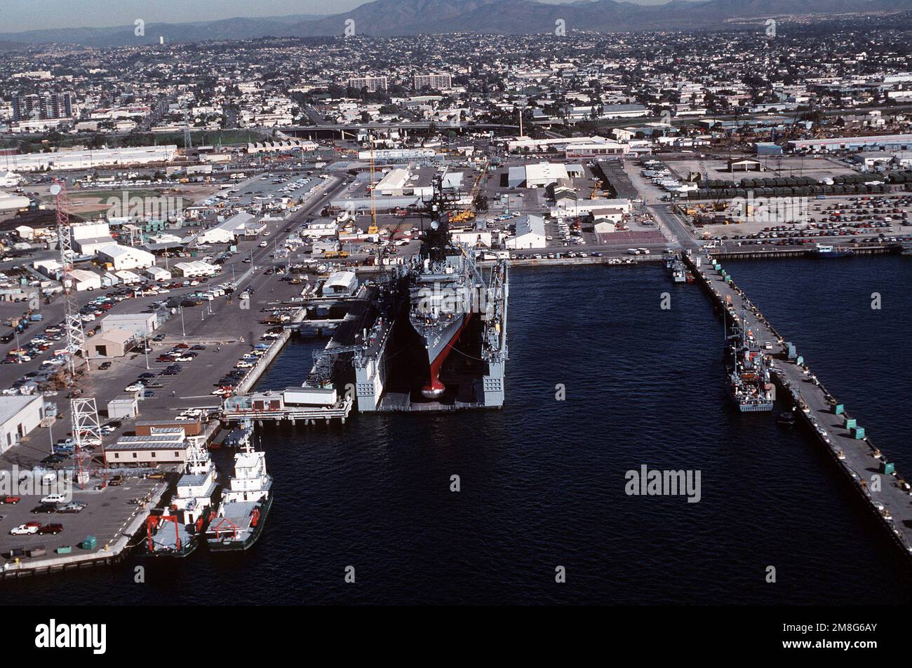 The destroyer USS KINKAID (DD-965) is positioned in the medium ...
