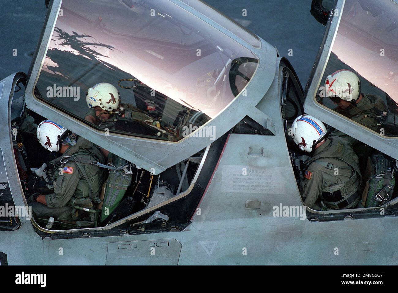 Air crew members conduct a preflight check on a Tactical Electronic ...