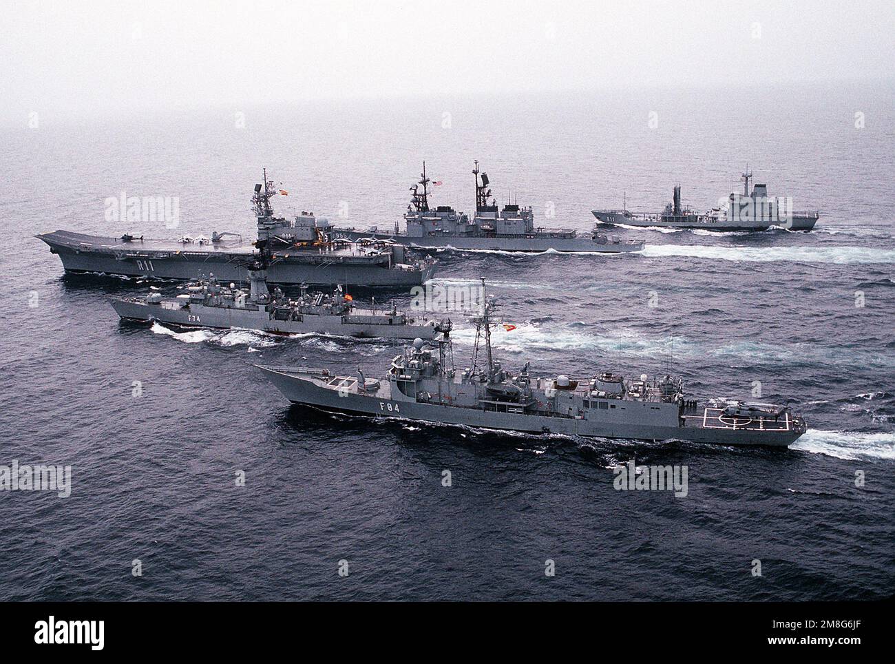 The guided missile destroyer USS SCOTT (DDG-995), second from the top ...