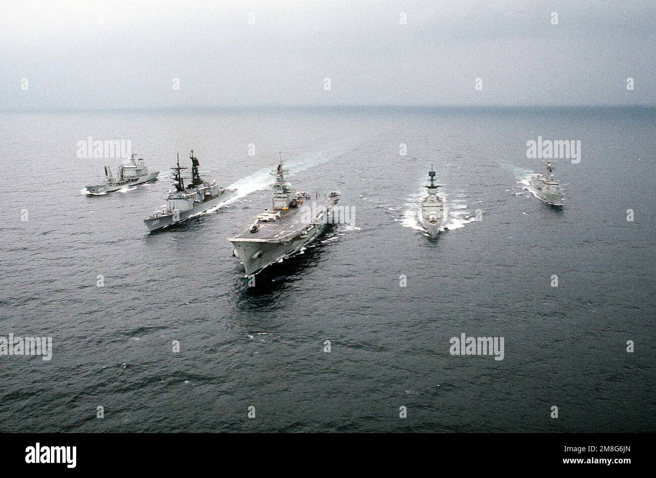 The guided missile destroyer USS SCOTT (DDG-995), second from the left ...