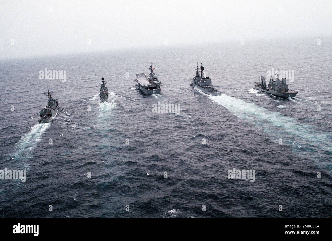 The guided missile destroyer USS SCOTT (DDG-995), second from the right ...