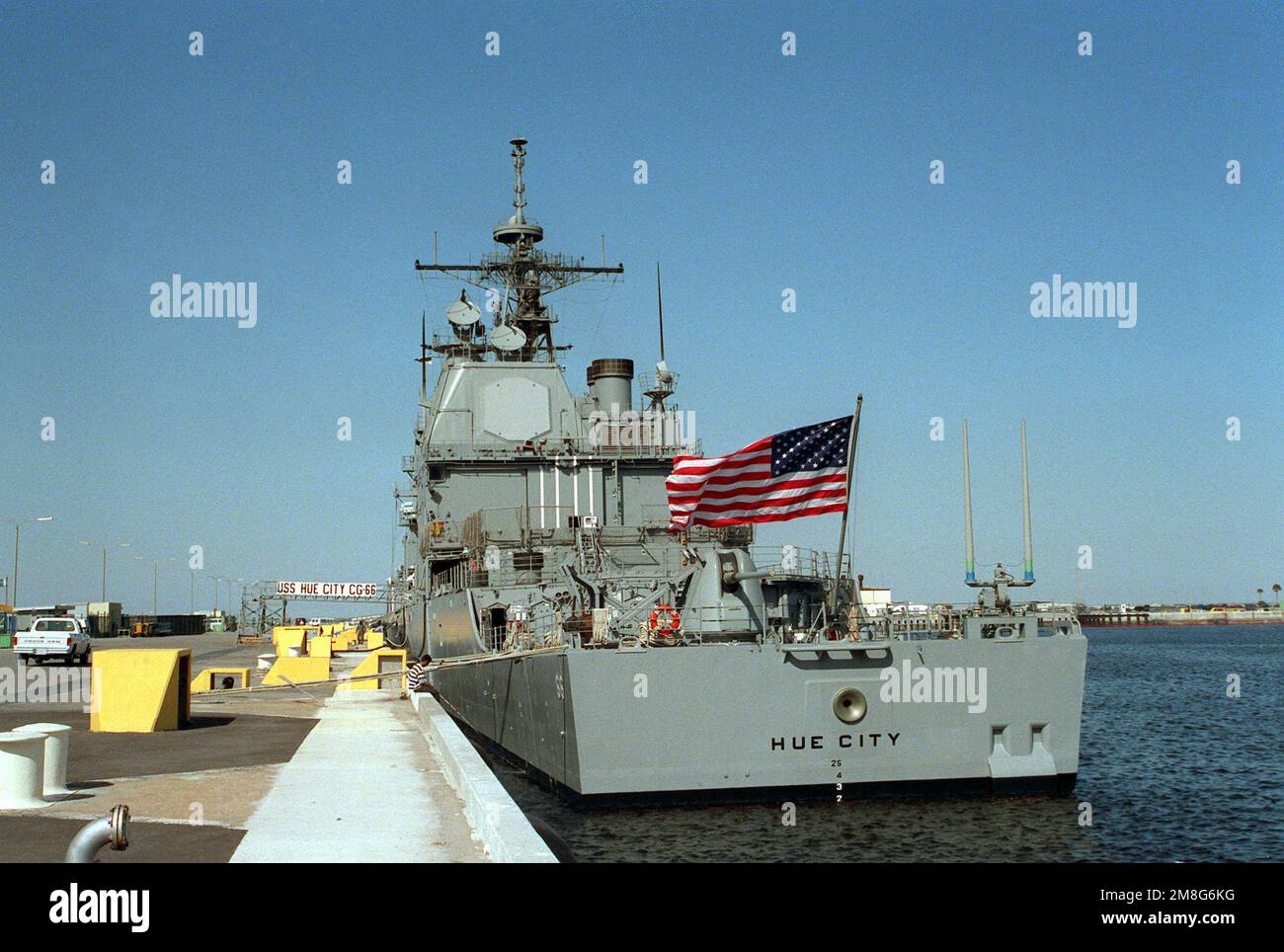 The American flag flies from the stern of the guided missile cruiser ...