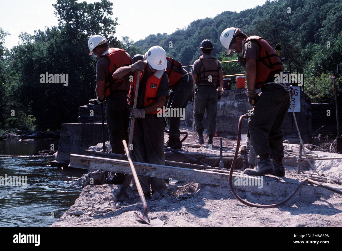 Members of Underwater Constuction Team 1 (UCT 1) break apart concrete ...