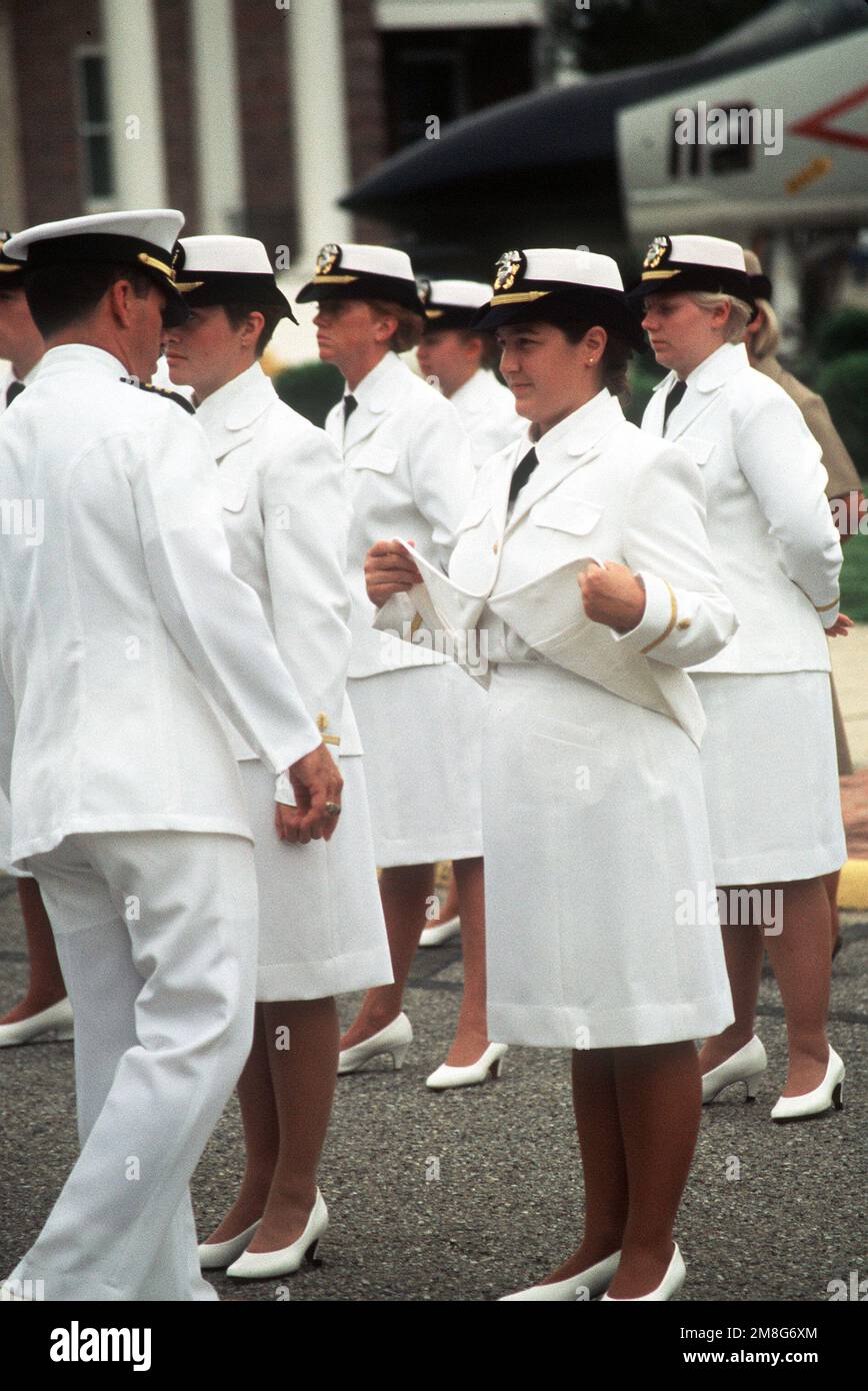 Navy nurse officer candidates take part in an inspection during part of ...