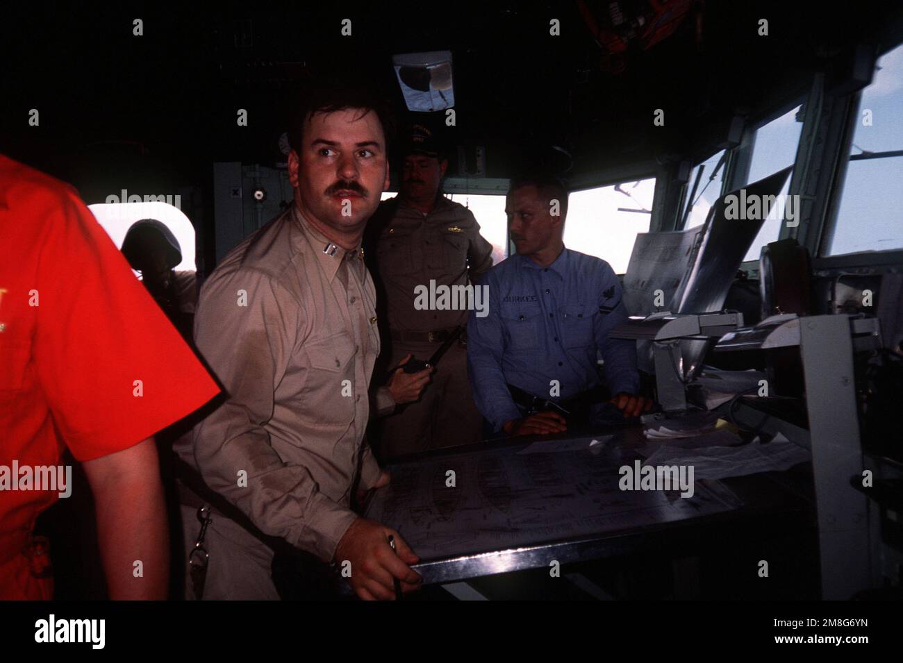 LT Michael Baumann coordinates damage control efforts from the bridge ...