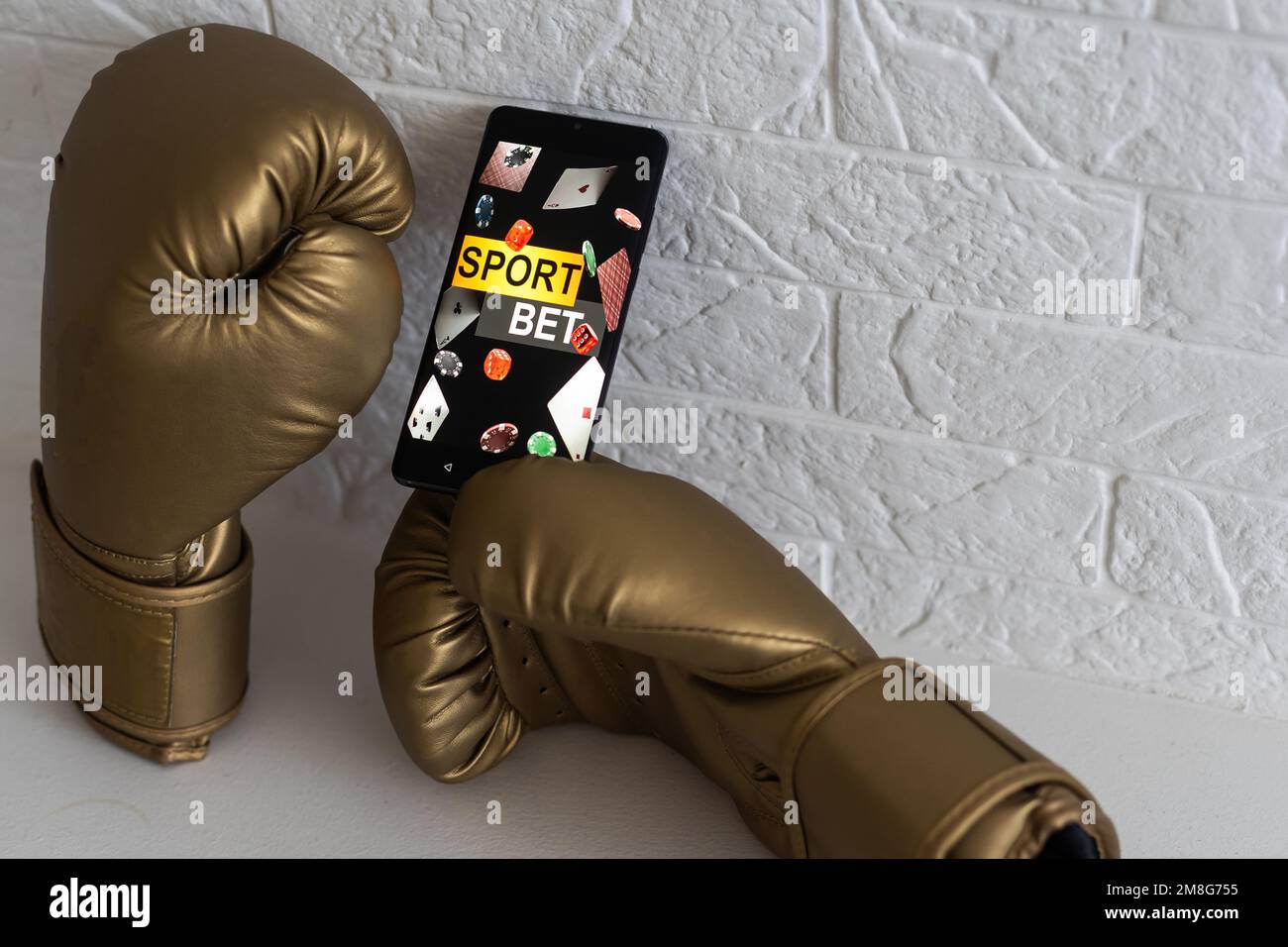 boxing gloves and smartphone with bets Stock Photo - Alamy