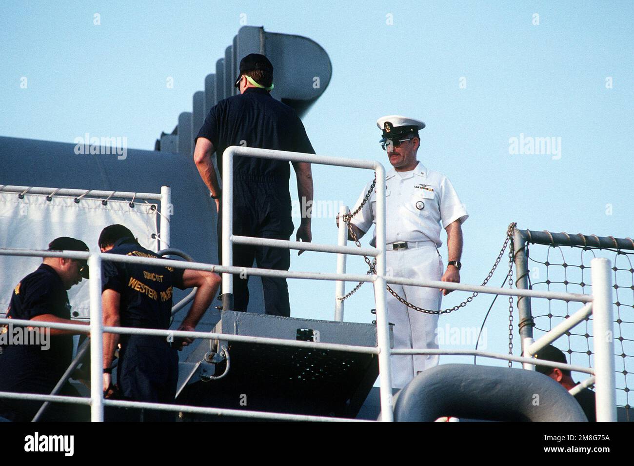 Members of the Fleet Training Group come aboard the amphibious ...