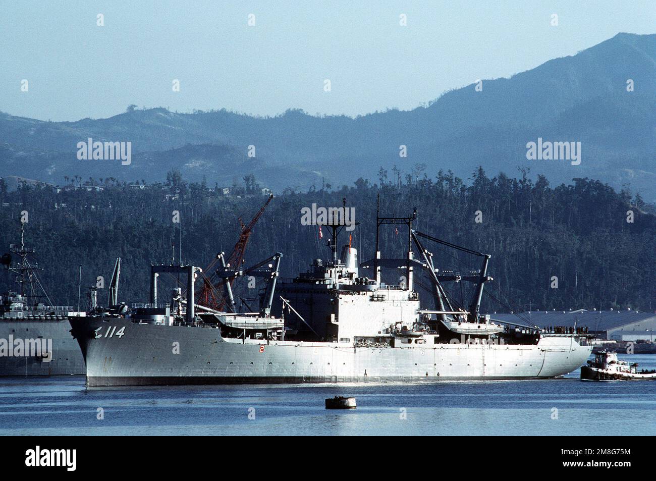 The large harbor tug WAUWATOSA (YTB-775) approaches the amphibious ...