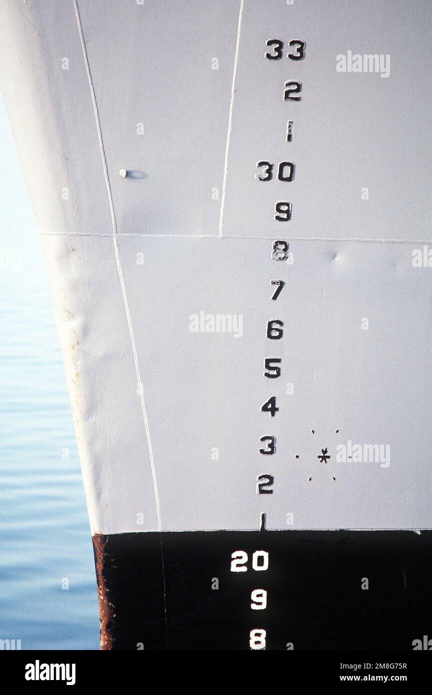 A close-up view of water level markings on the bow of a U.S. Navy ship ...