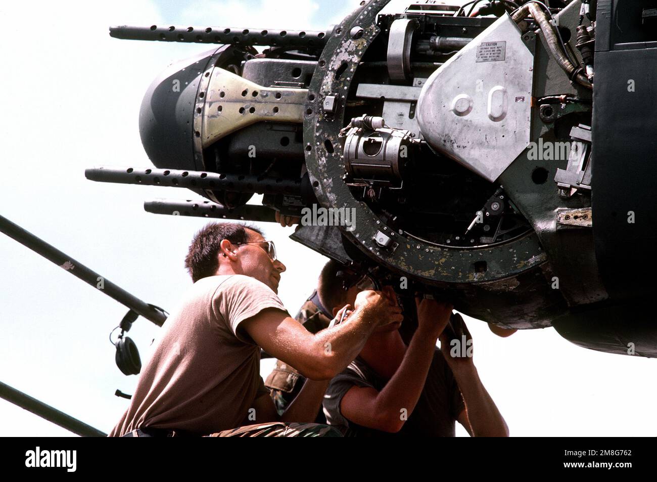 STAFF SGT. Brian D. Land checks a .50-caliber tail turret gun on a B ...