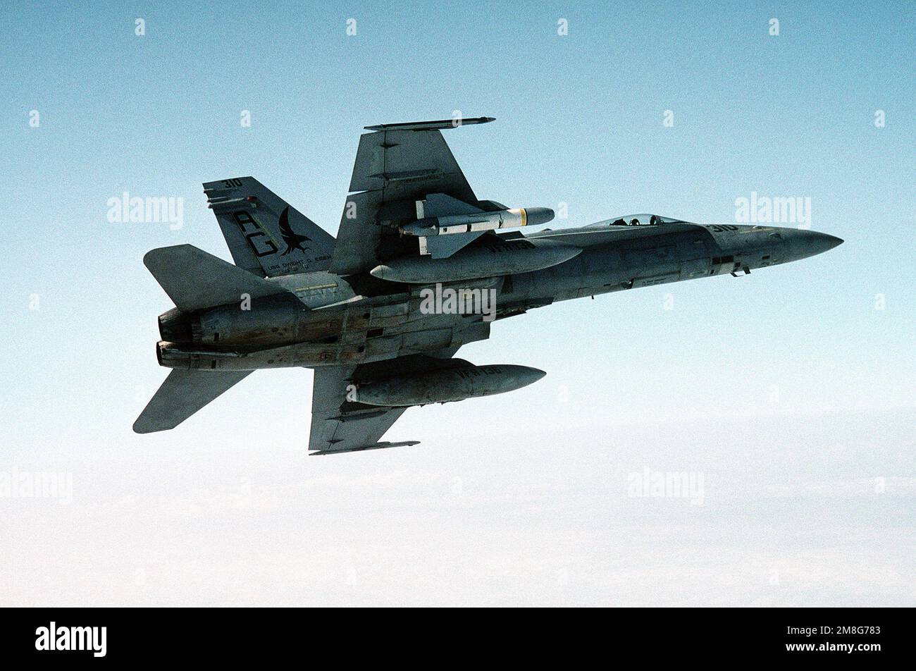 An air-to-air, underside view of an F/A-18C Hornet from Strike Fighter ...