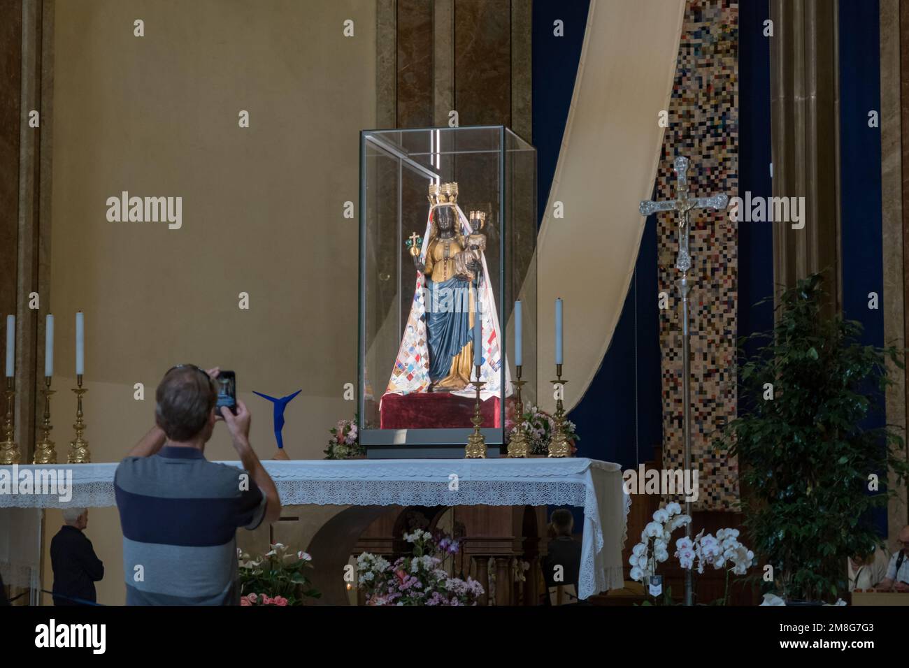 A view of the Statue of the Black Madonna of Oropa with a patchwork ...