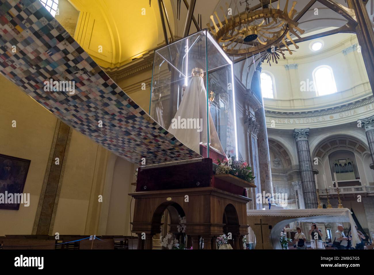 A view of the Statue of the Black Madonna of Oropa with a patchwork ...