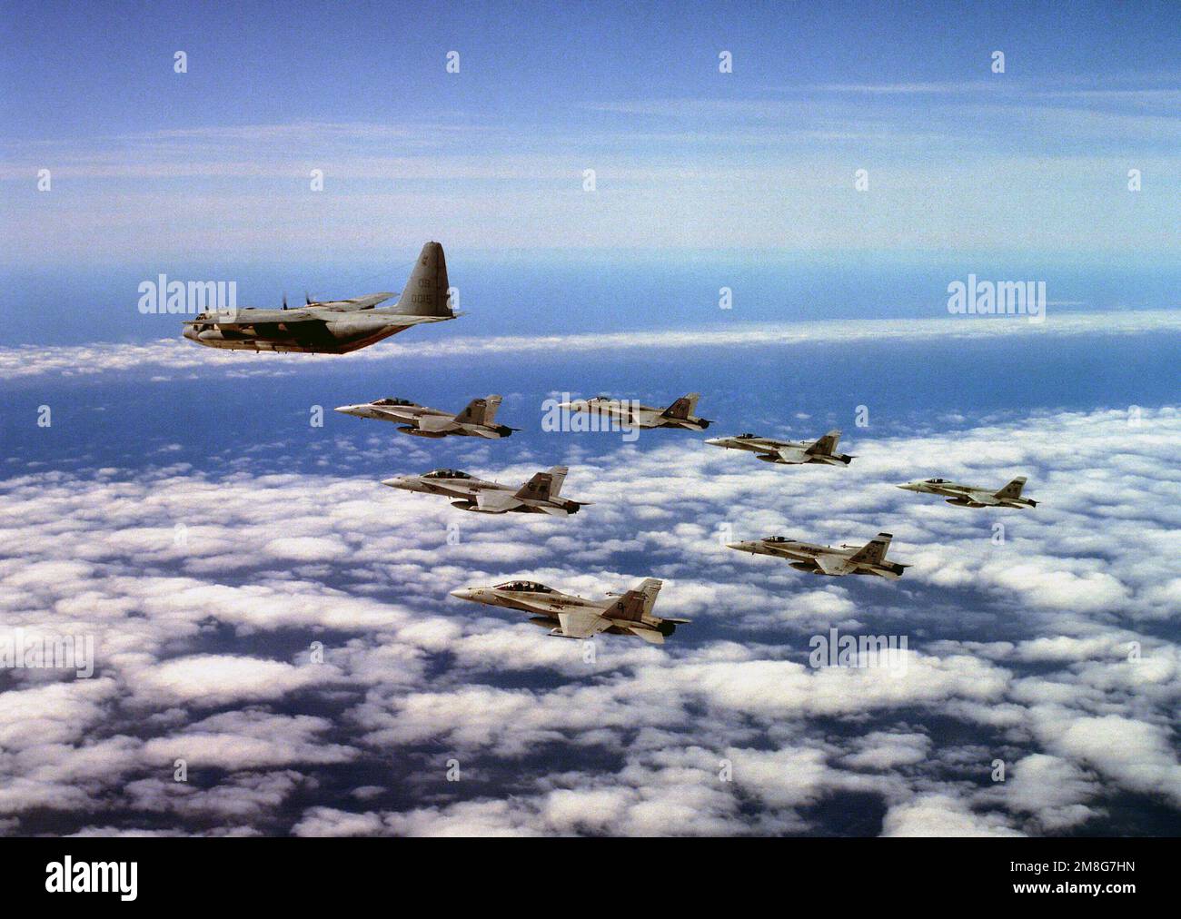Left side view of a formation of seven F/A-18A and F/A-18D Hornet ...