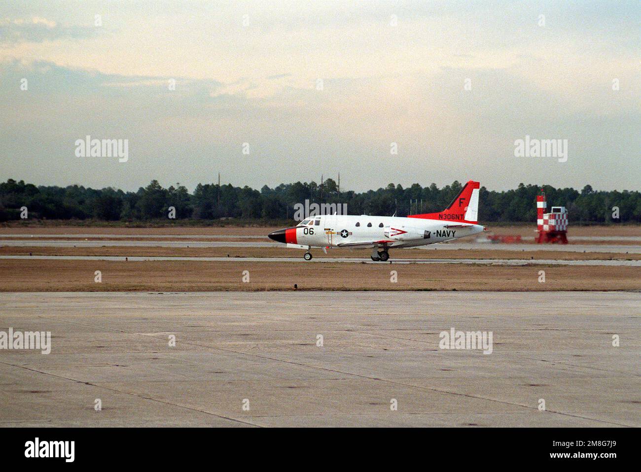 A Training Wing 6 CT-39G Sabreliner aircraft stands on the runway in ...