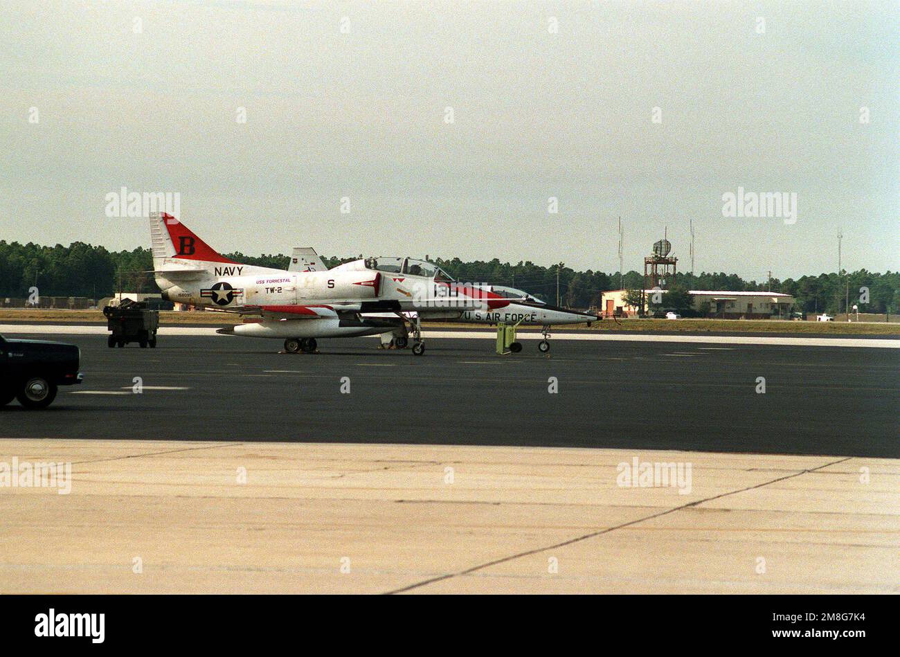 A Training Wing 2 TA-4J Skyhawk aircraft stands on the runway. Base ...