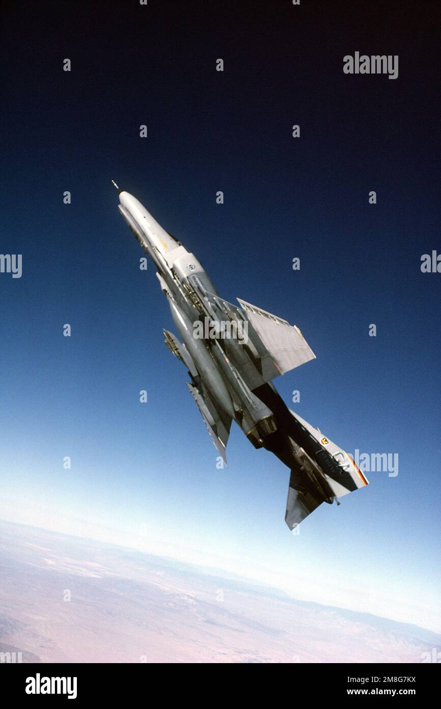 An air-to-air left side view of a 35th Tactical Fighter Wing F-4E ...