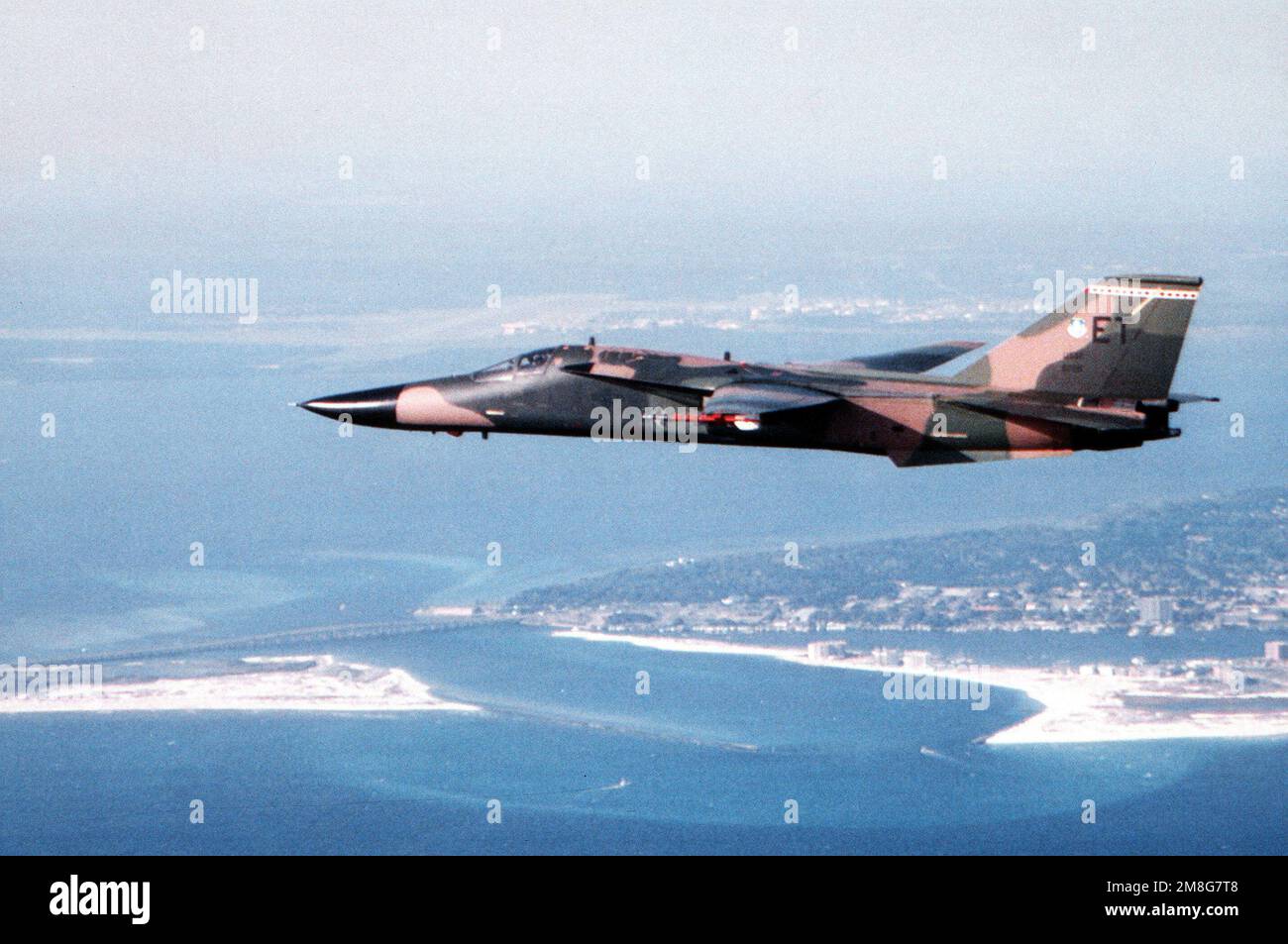 Air to air view of an AIM-9 Sidewinder air-to-air missile on an F-111 ...