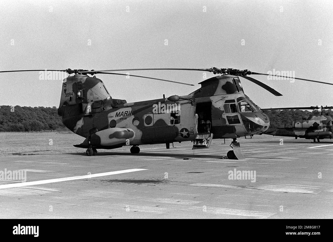 A CH-46E Sea Stallion helicopter waits on the ground at Landing Zone ...