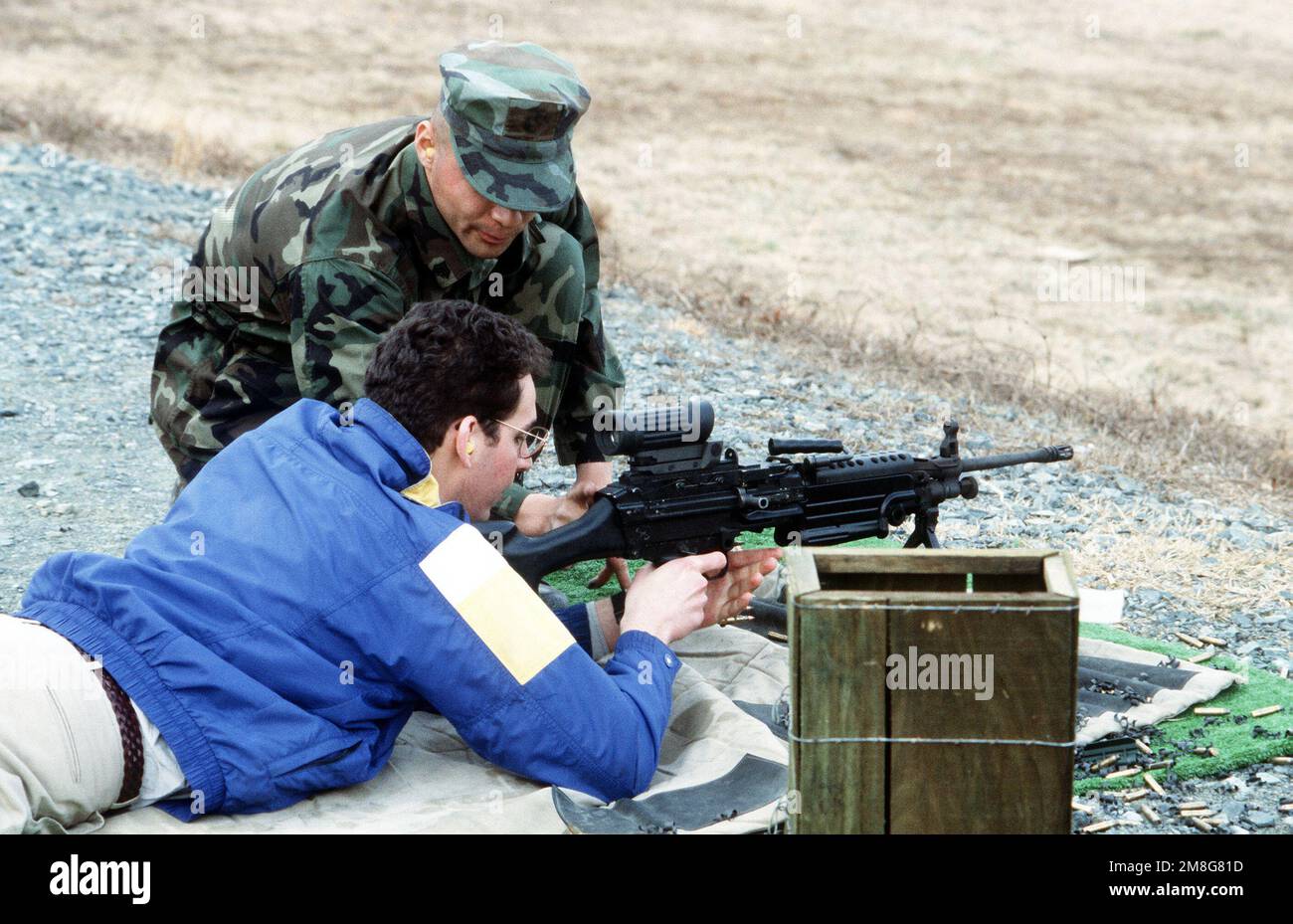 A Marine sergeant explains th operation of an M-249 squad automatic ...