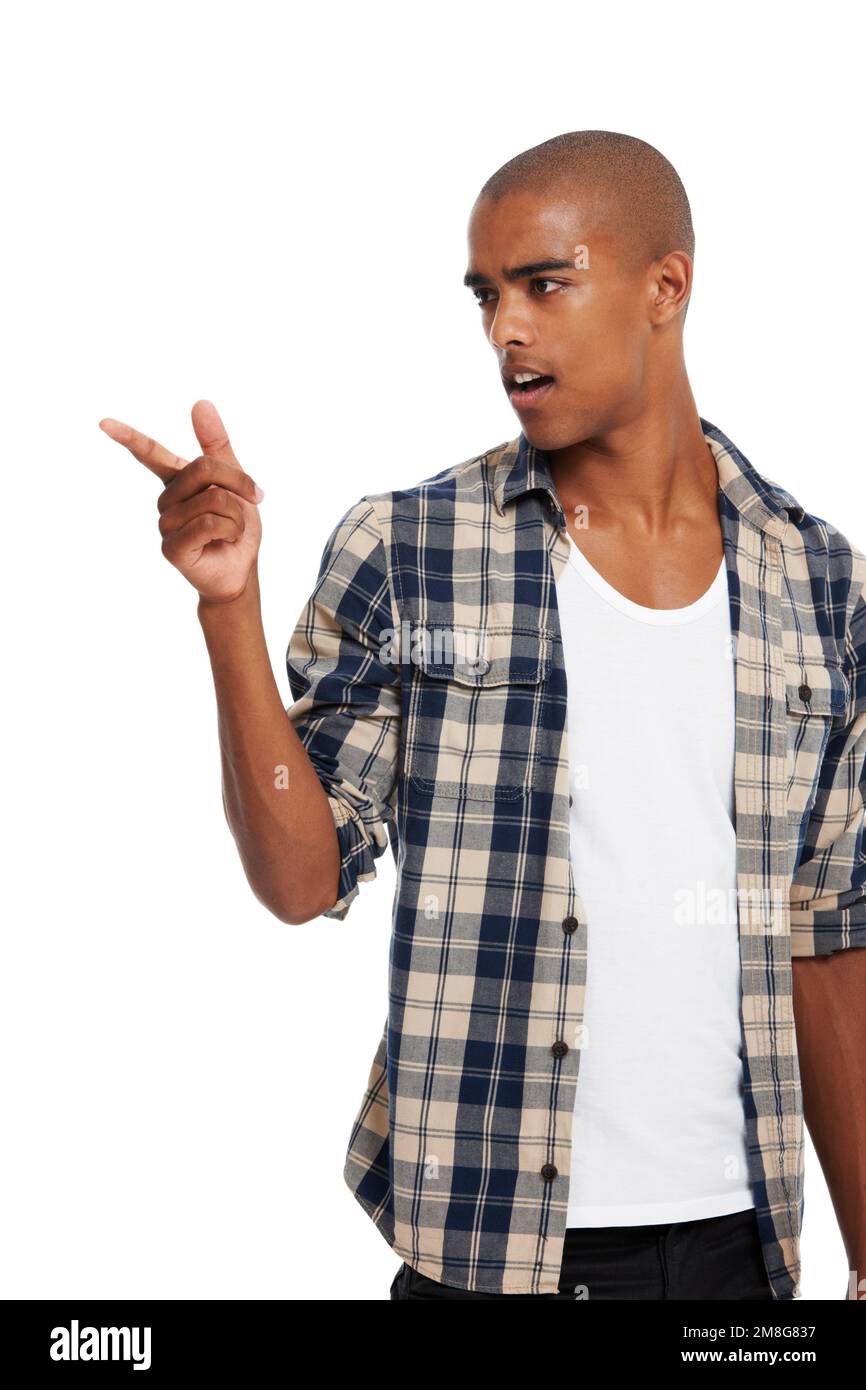 Fashion, casual and man pointing in studio with a omg, wtf or surprise ...